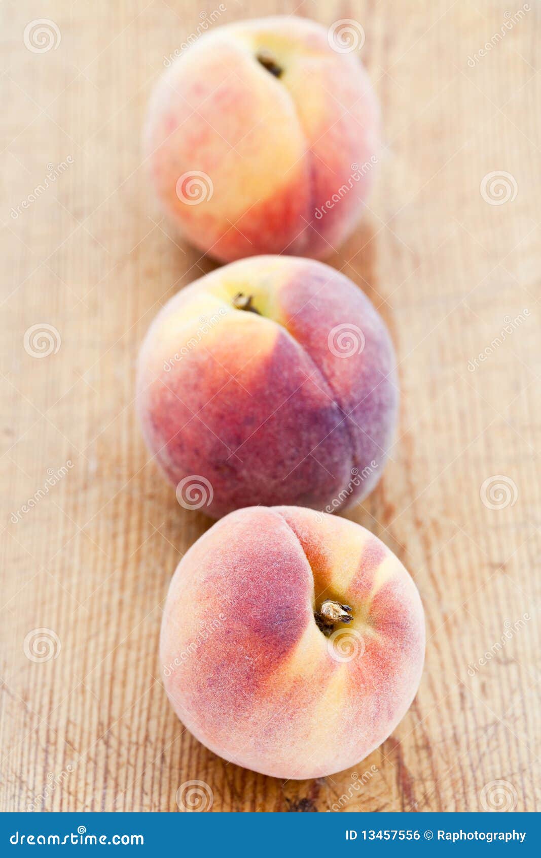 Three peaches in a row stock photo. Image of ripe, meal - 13457556