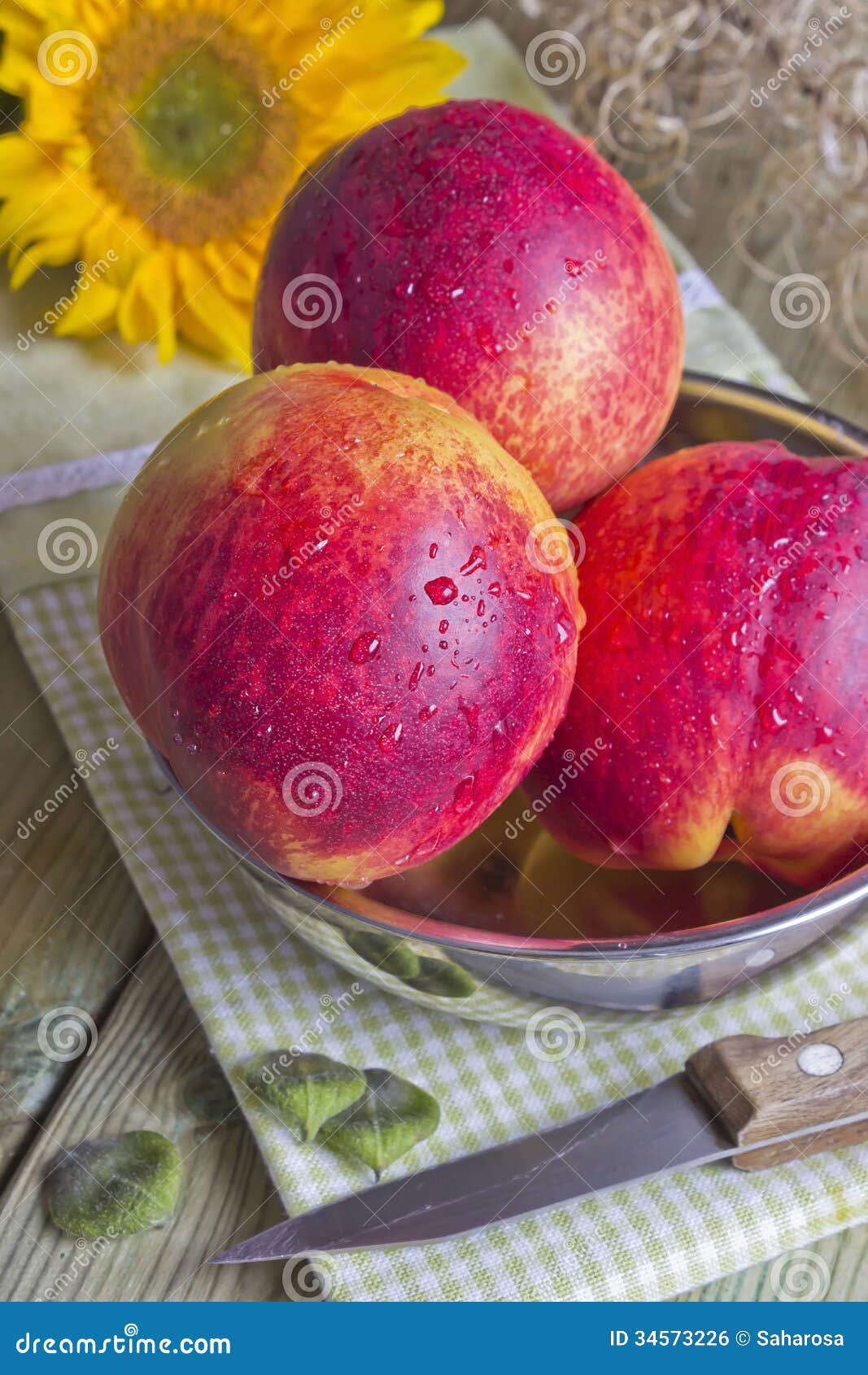 Three peaches on the table stock photo. Image of knife - 34573226