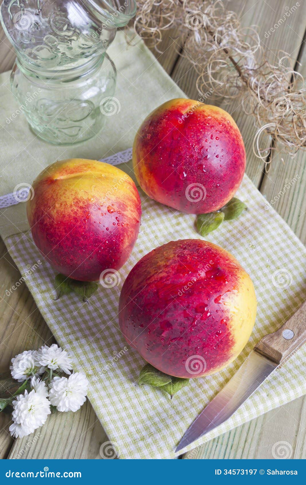 Three peaches on the table stock image. Image of sweet - 34573197