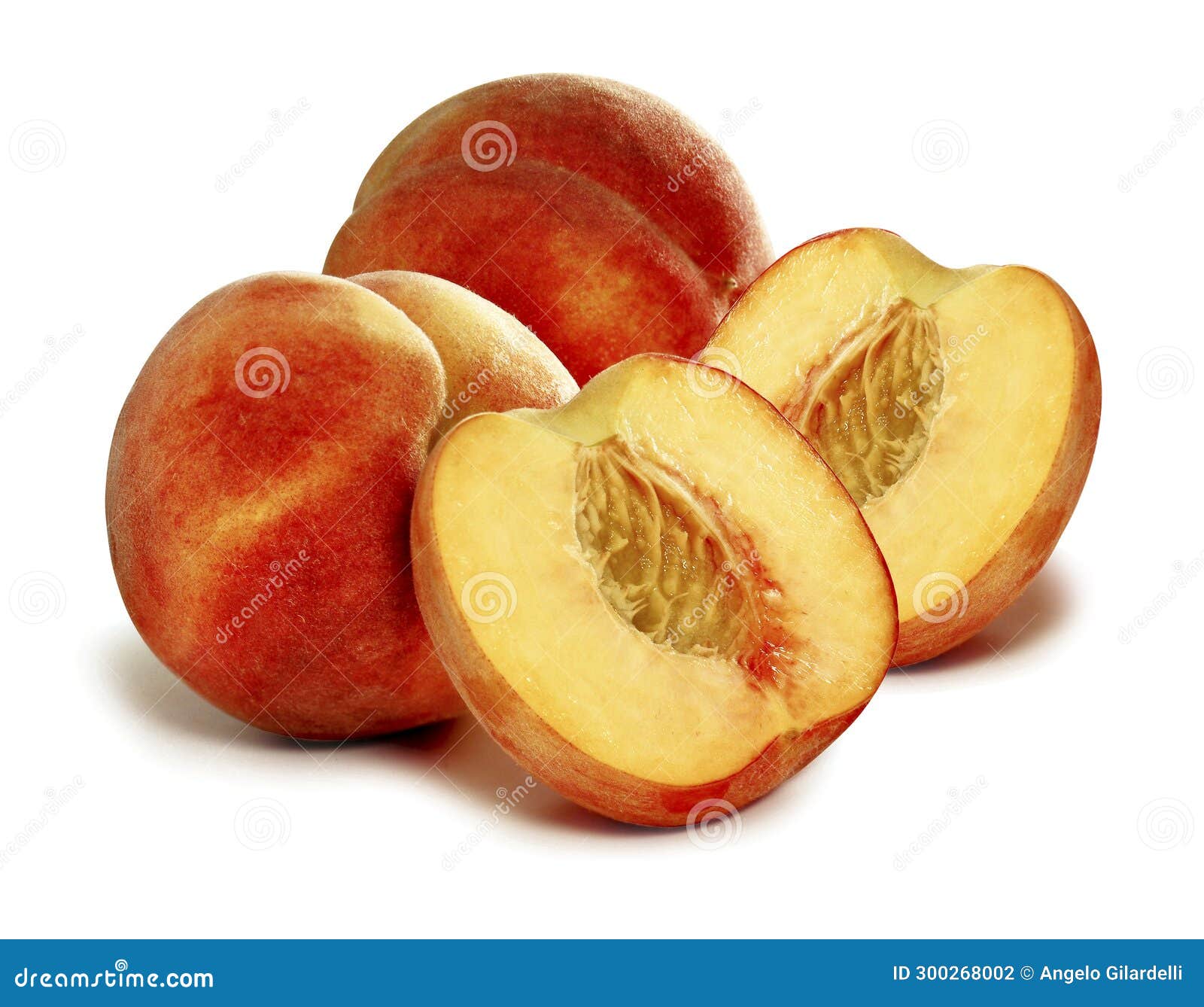 Three Peaches, Two of Which are Whole and One Cut in Half on White ...