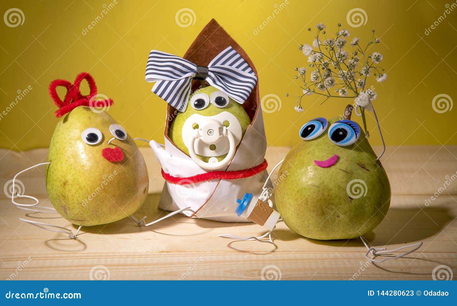 Three Pears are on the Table.One Pear-mother, the Second Pear-child and ...