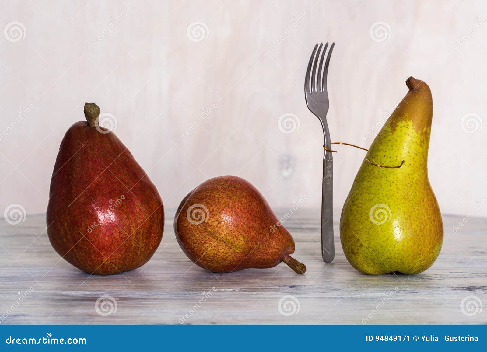 Three Pears on a Wooden Table . Conceptual Photos. One Pear with a Fork ...