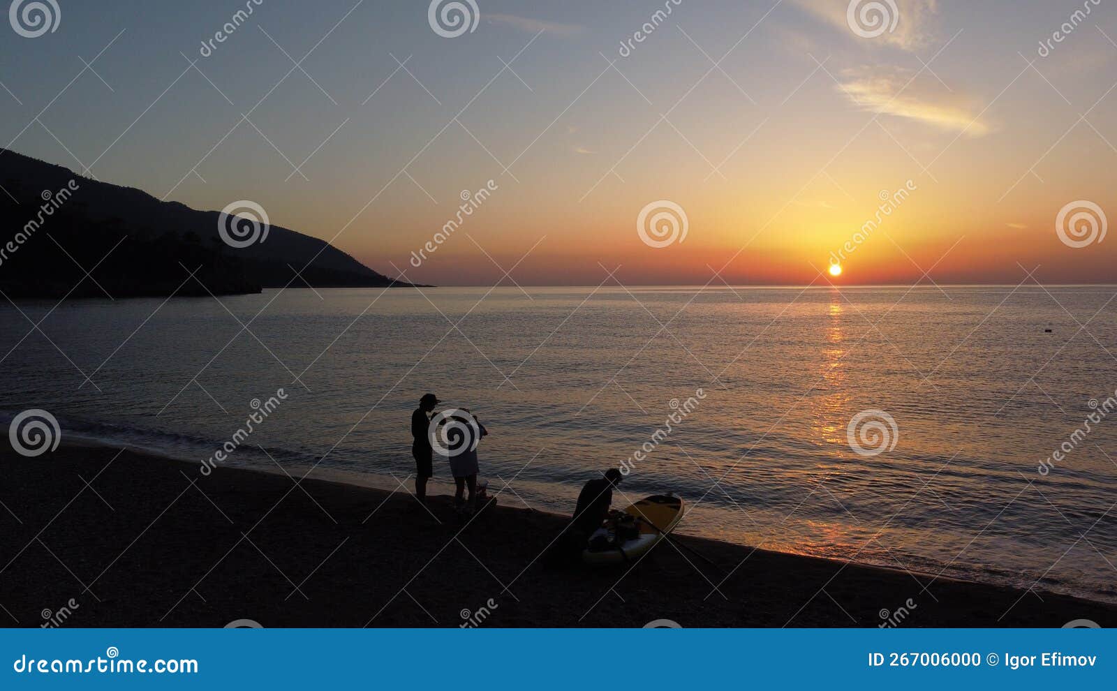 Three People on the Beach Meet the Sunset Stock Photo - Image of ocean ...