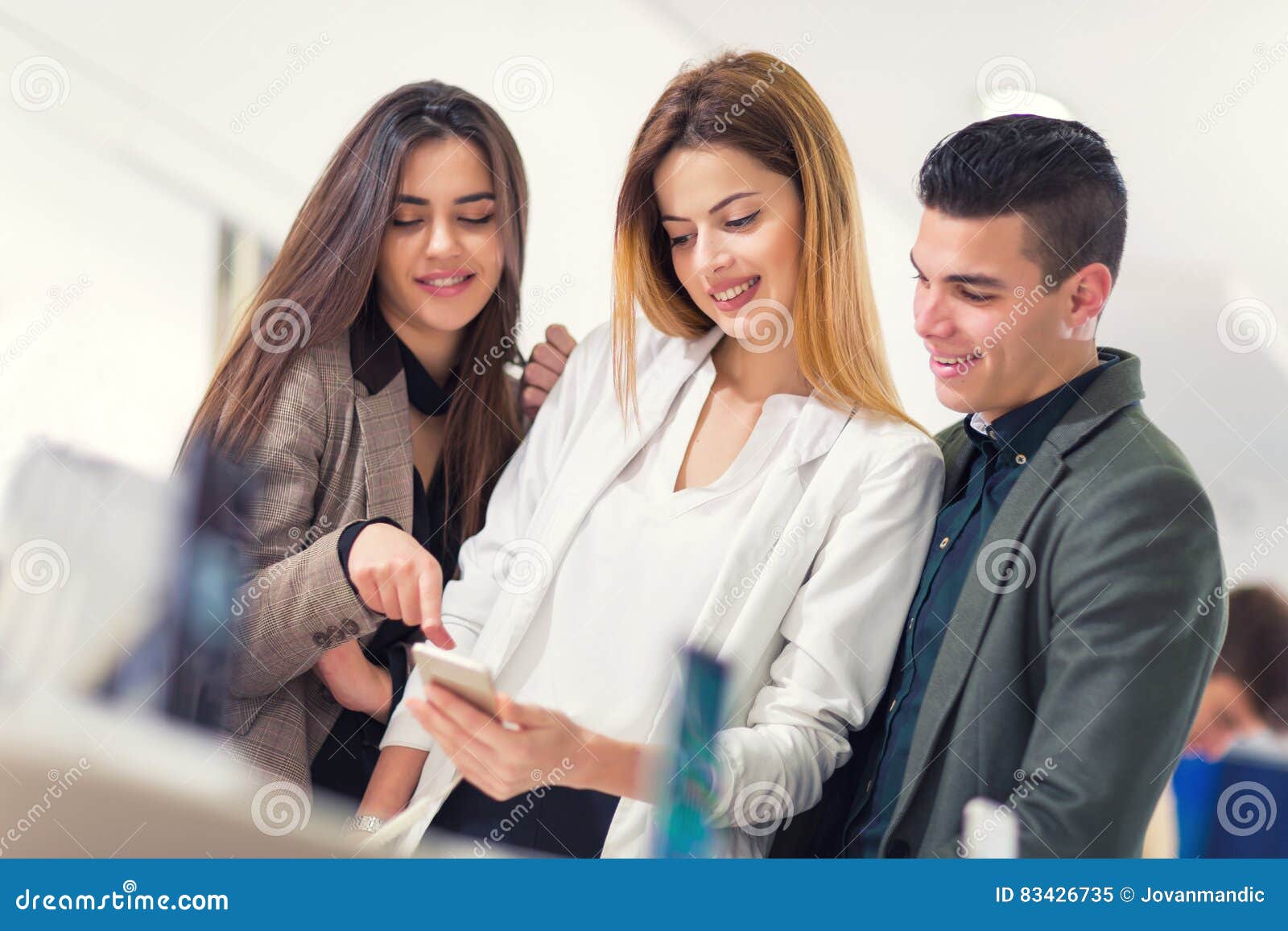 Three People are Choosing Smart Phones Stock Image - Image of looking ...