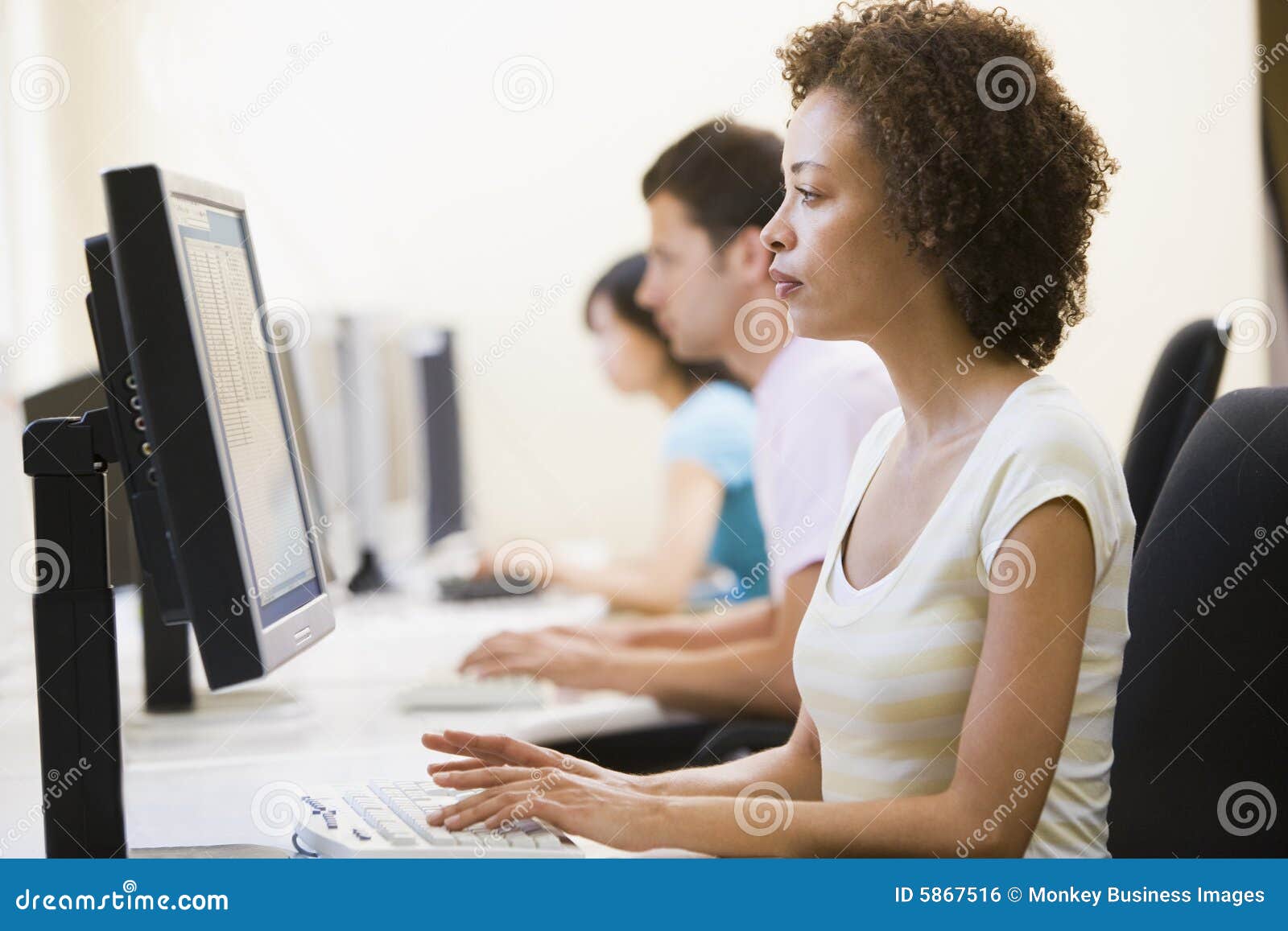 Three People in Computer Room Typing Stock Photo - Image of horizontal ...