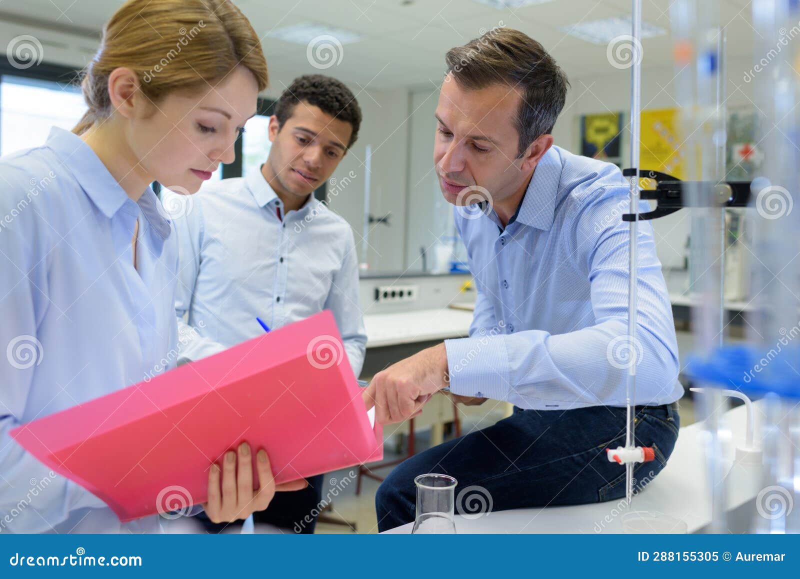 Three People in Discussion in Science Laboratory Stock Image - Image of ...