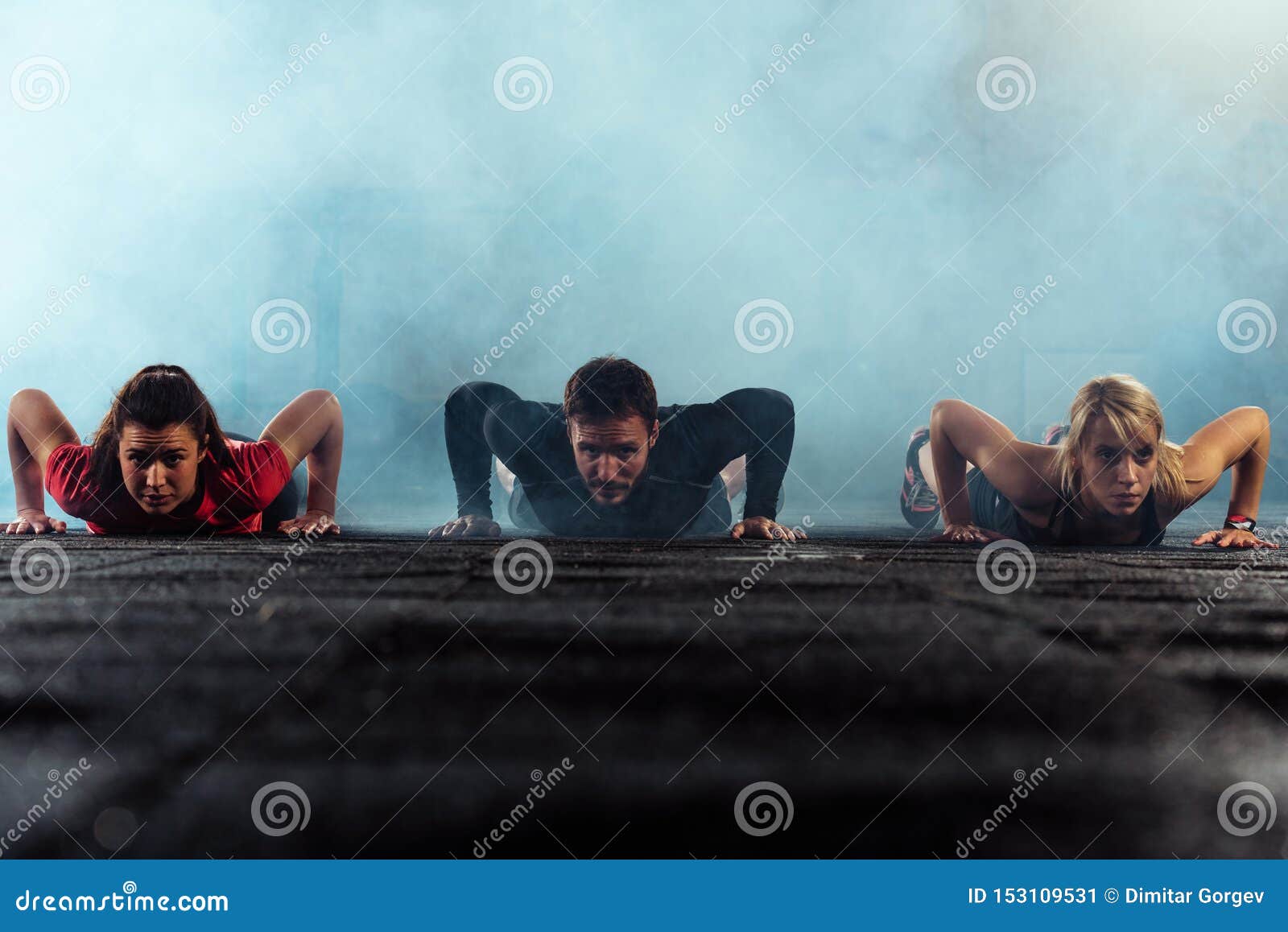 Three People Doing Pushups at Training in Gym Stock Image - Image of ...