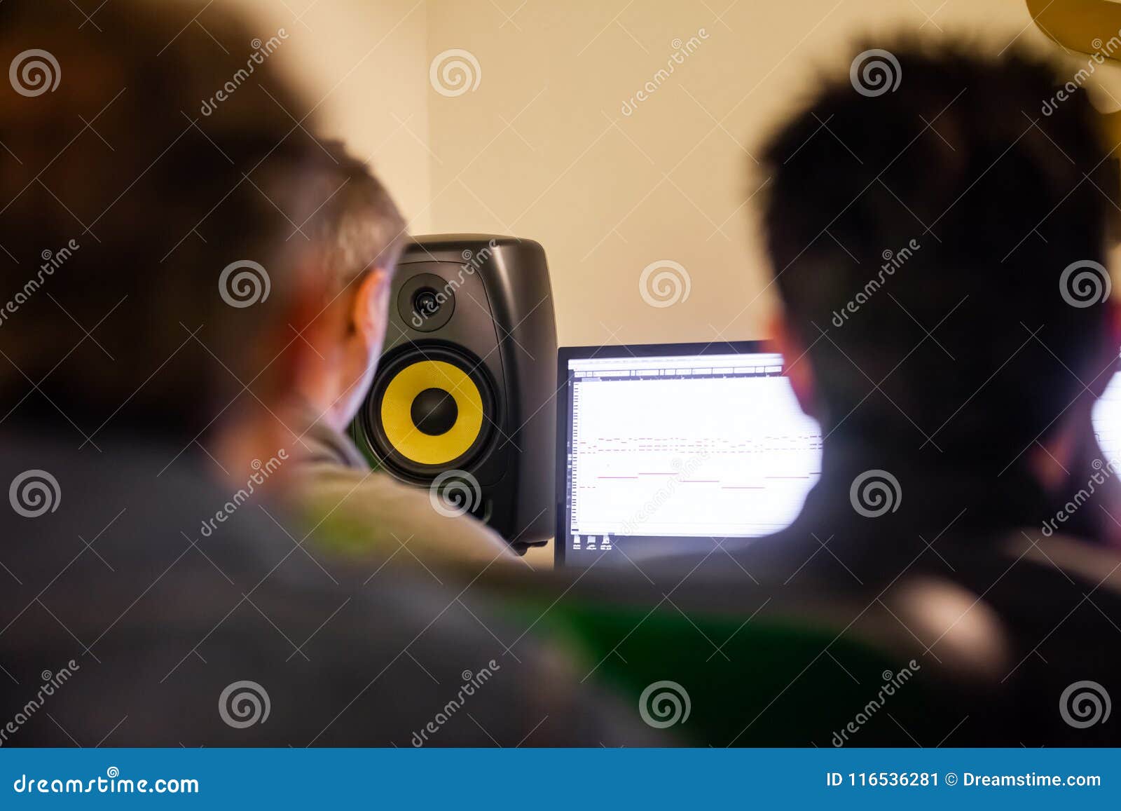 Three People Editing a Song in a Production Studio Stock Image - Image ...
