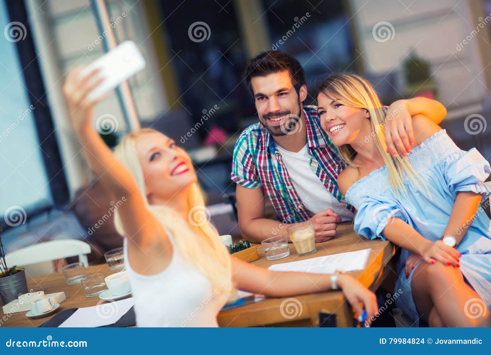 Three People Having Fun in Cafe Stock Photo - Image of females ...