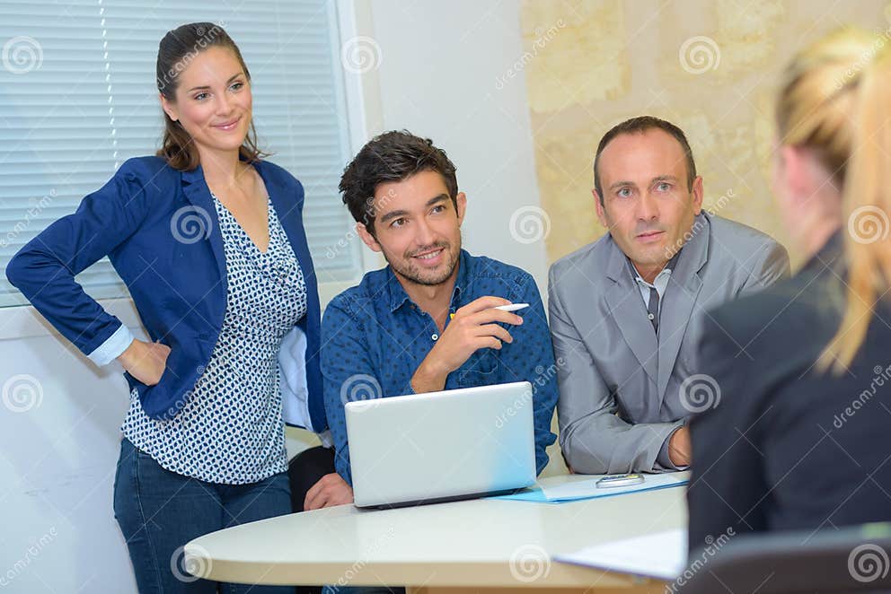 Three People Interviewing Woman Stock Photo - Image of woman ...
