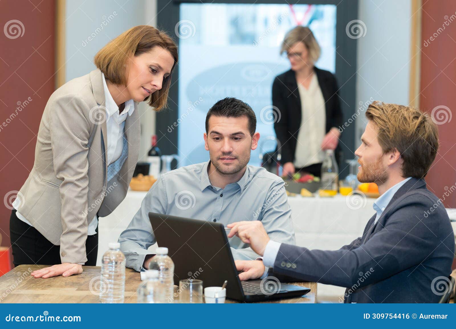 Three People Looking at Laptop Stock Photo - Image of group, team ...