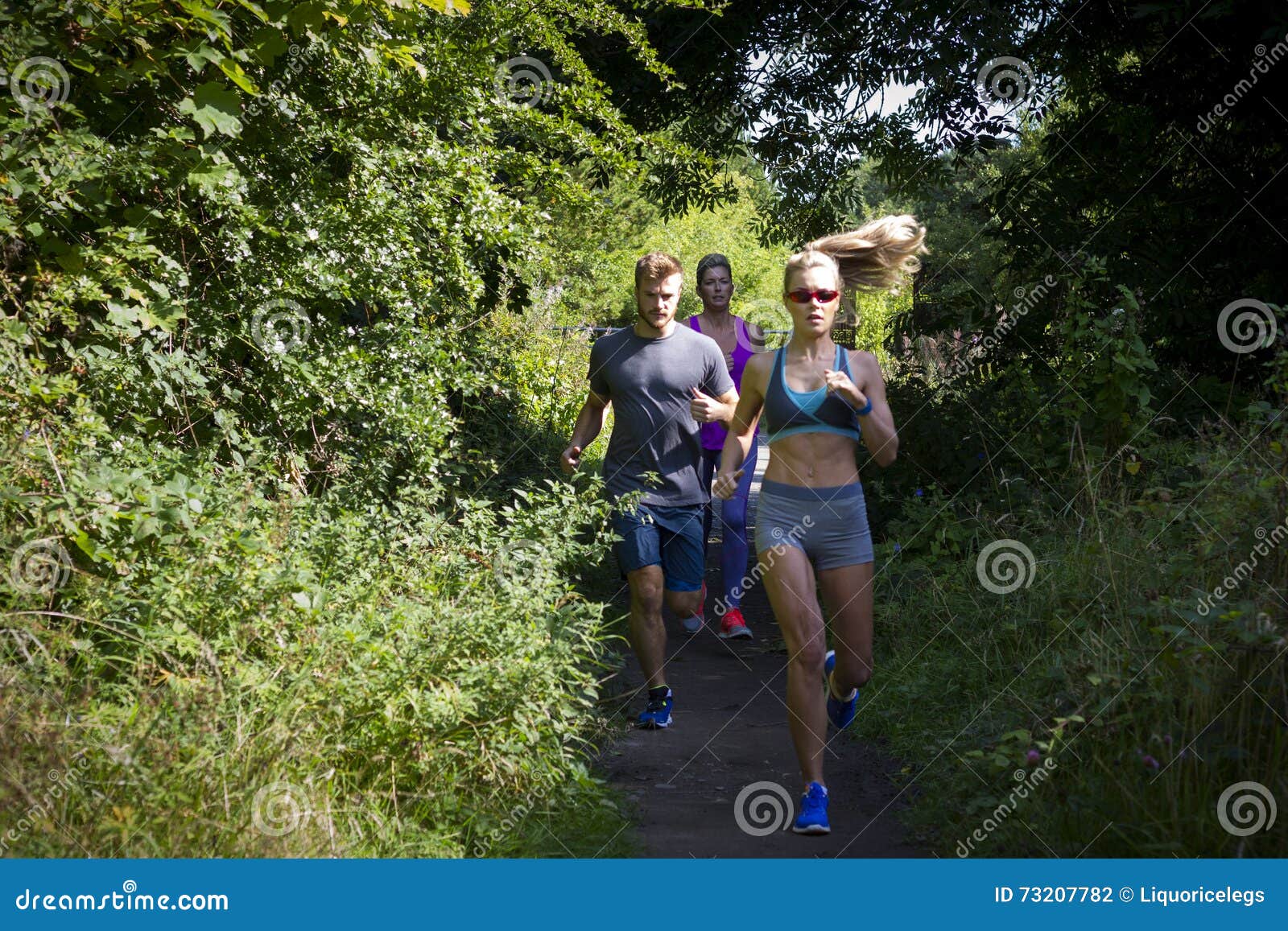 Three People Running stock photo. Image of sports, fitness - 73207782