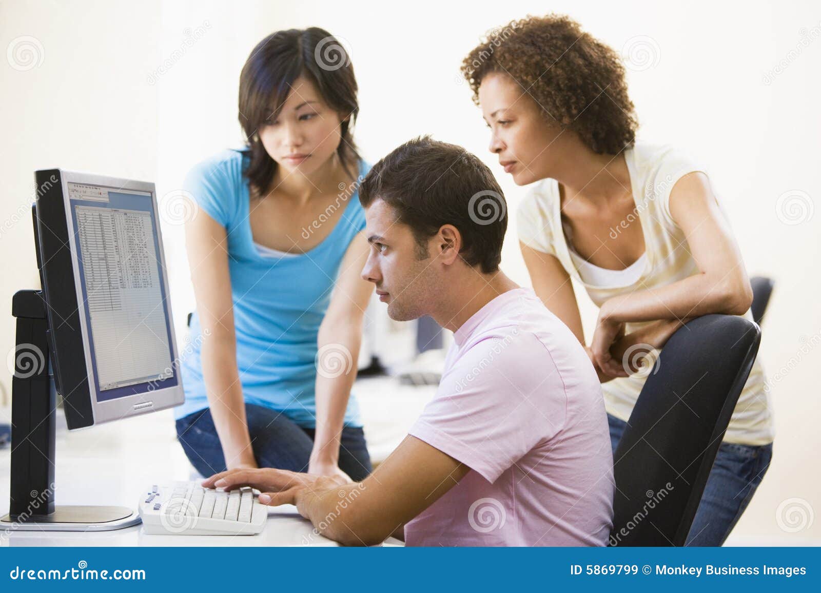 Three People Sitting in Computer Room Stock Image - Image of business ...