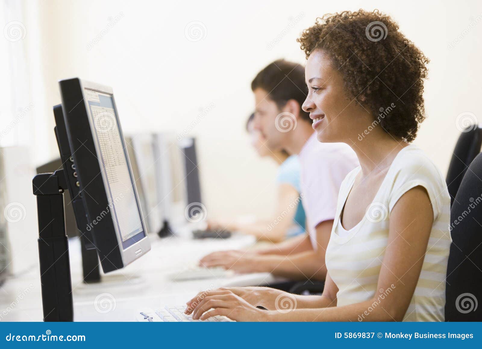 Three People Sitting in Computer Room Typing Stock Image - Image of ...