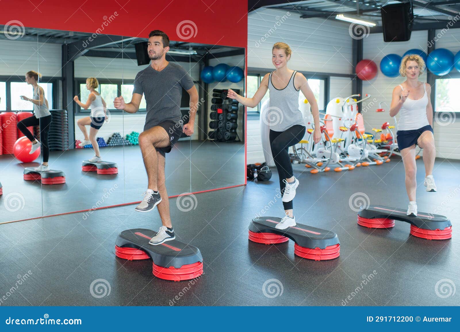 Three People Sychronised during Step Class Stock Photo - Image of ...