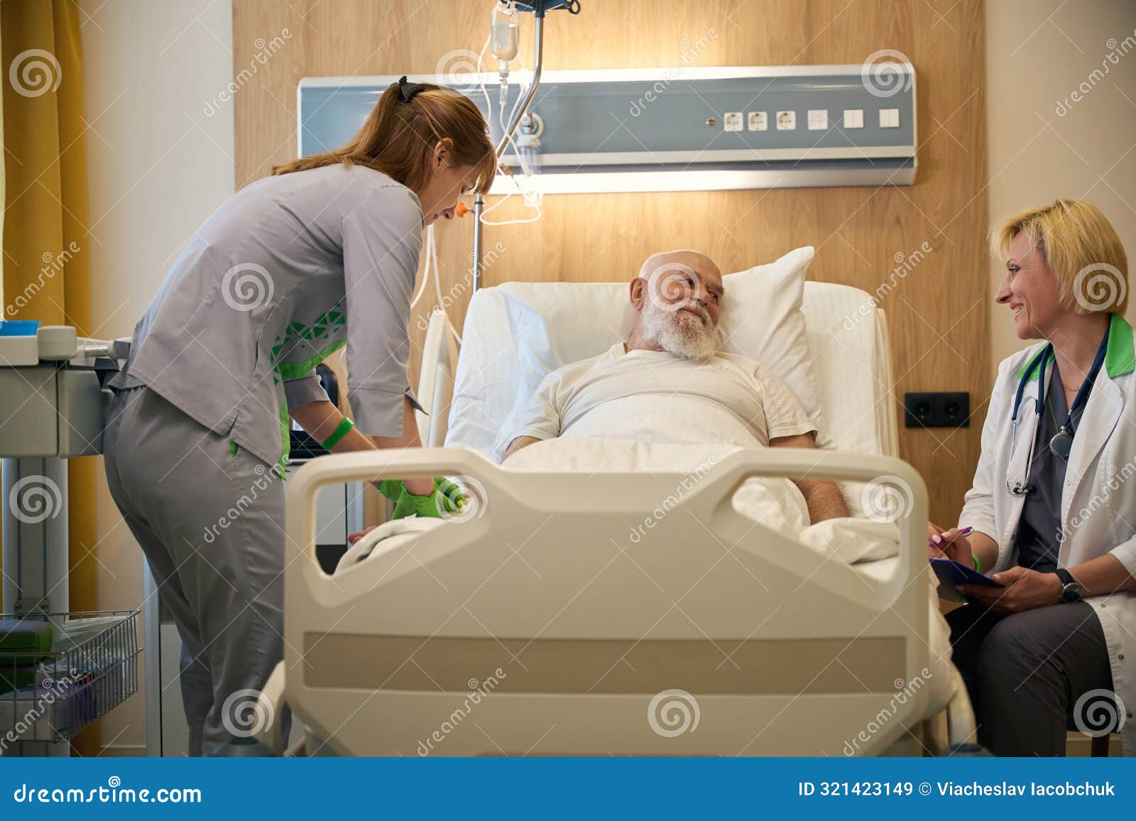Three People Talking in a Hospital Room Stock Image - Image of ...