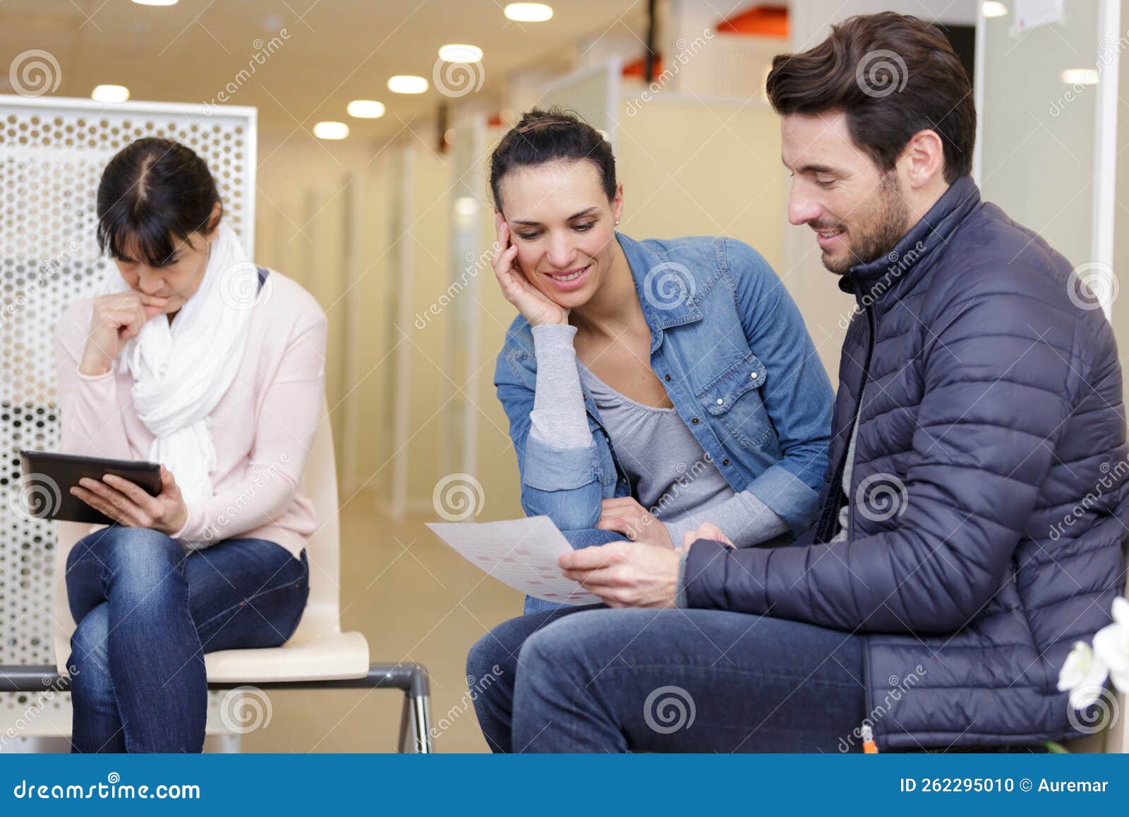 Three People in Waiting Area for Medical Appointment Stock Photo ...