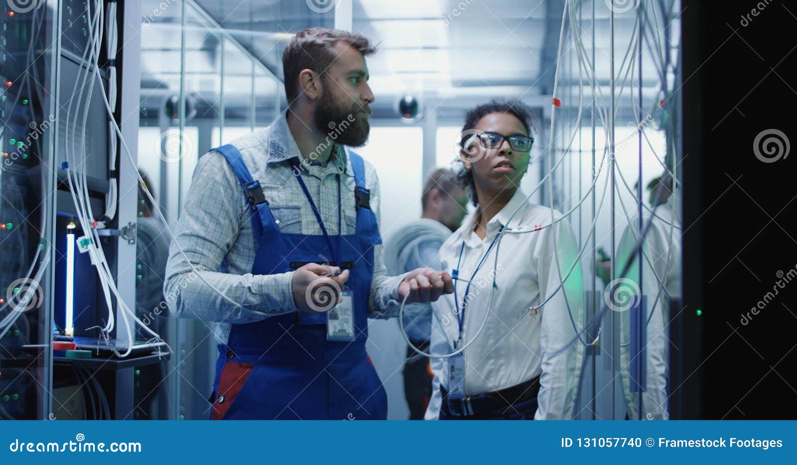 Three People Working in a Data Center Stock Photo - Image of system ...