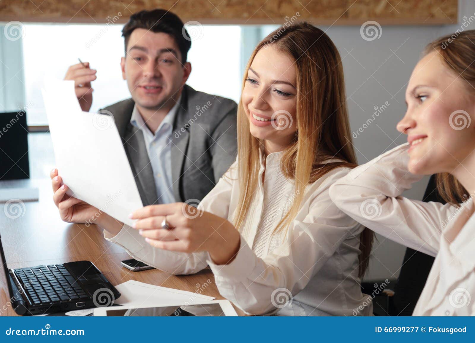 Three People Working in Office with Documents Stock Image - Image of ...