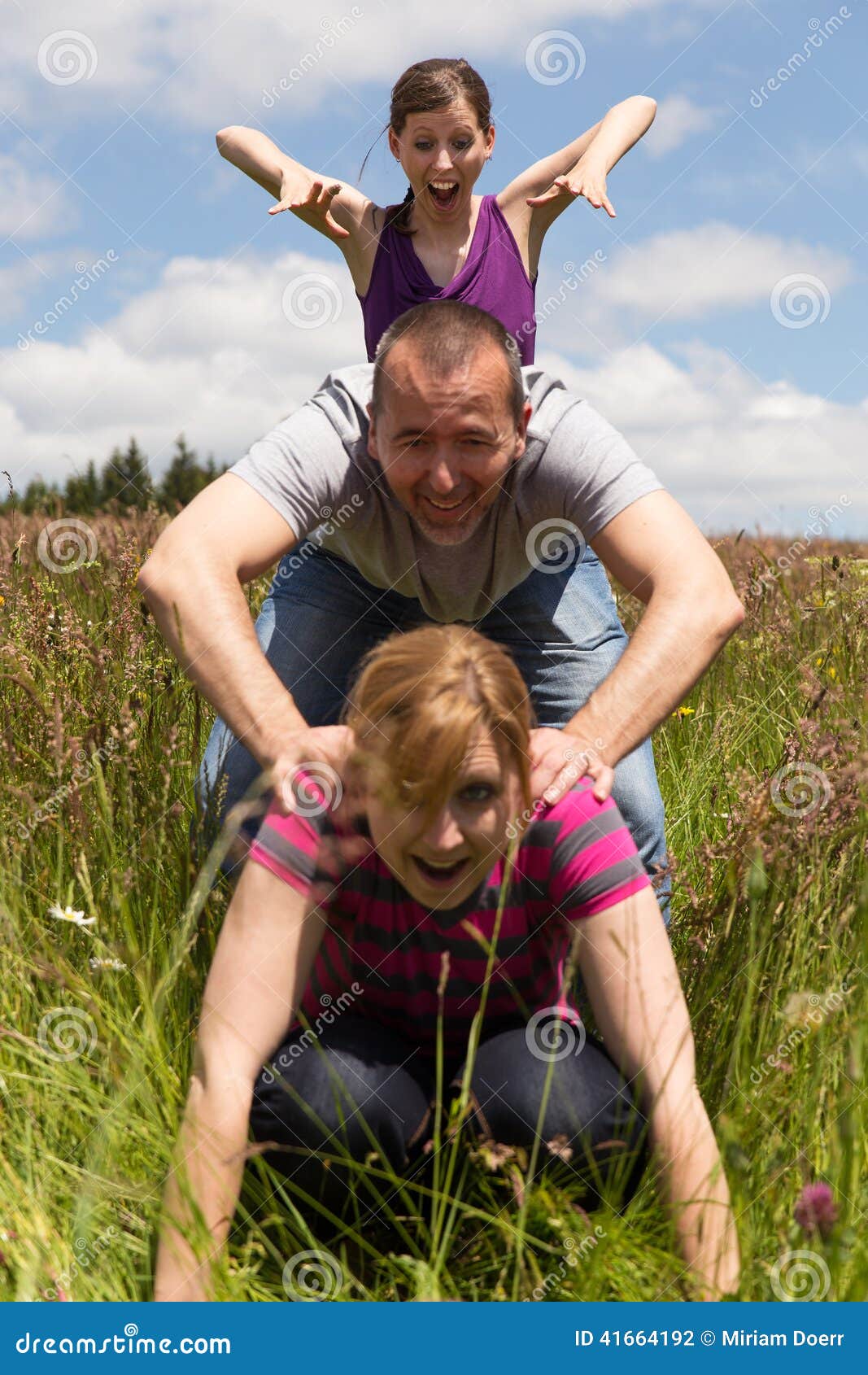 Three Persons are Making a Leapfrog Jump Stock Photo - Image of clouds ...
