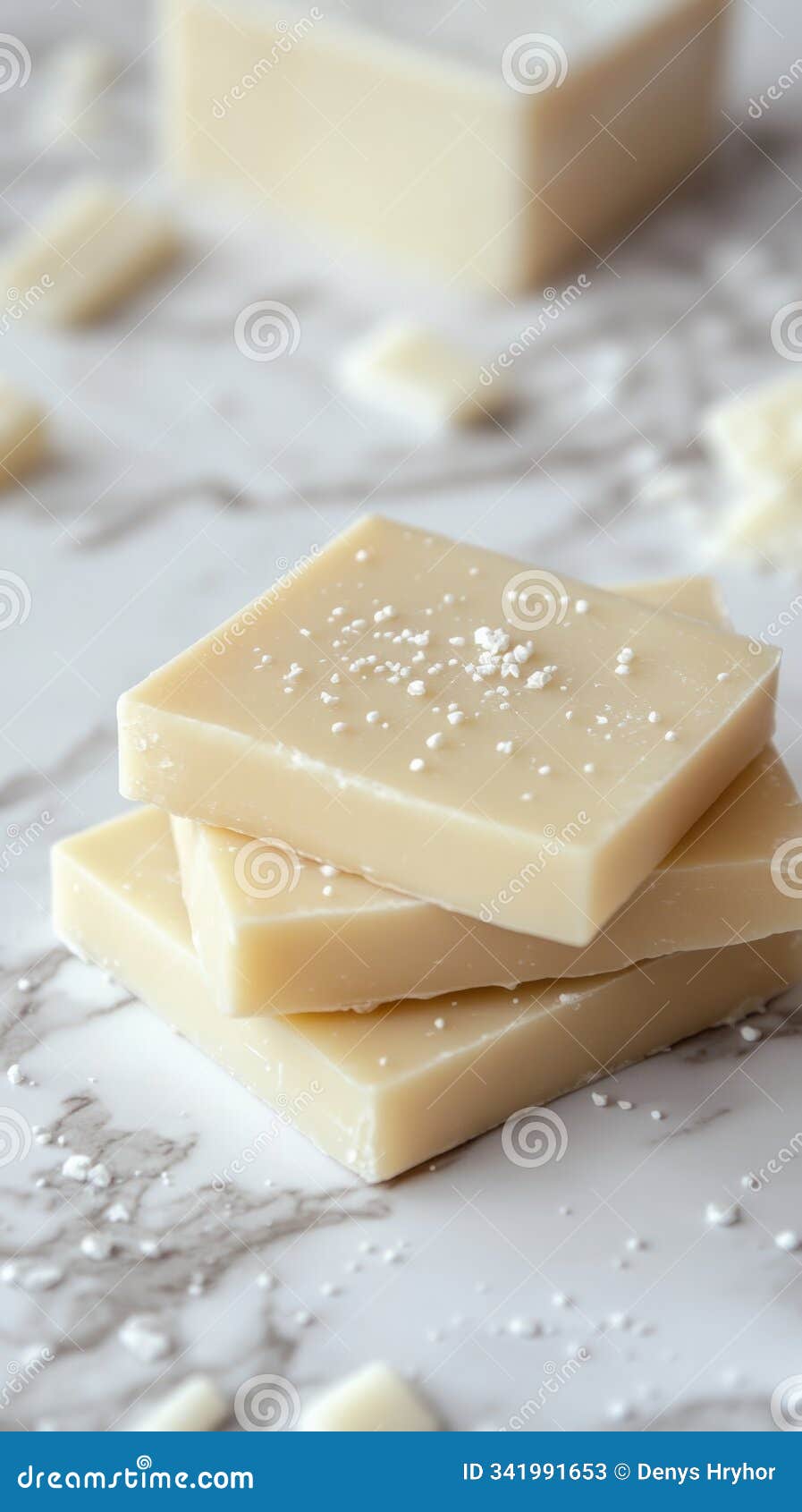 Three Pieces of Smooth, Creamy Cheese are Stacked on a Marbled Surface ...