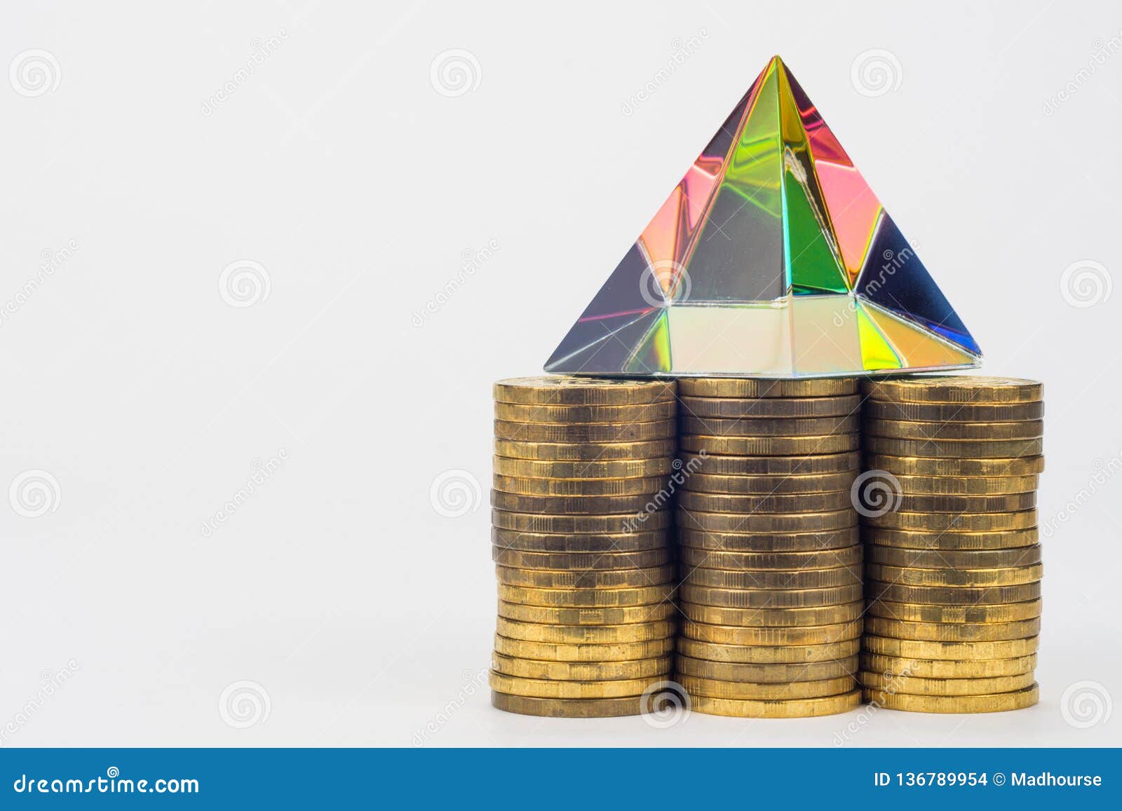 Three Piles of Coins, There is a Glass Pyramid on Them, To the Right is ...