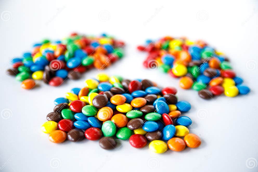 Three Piles of Colored Smarties Stock Photo - Image of sweet, group ...