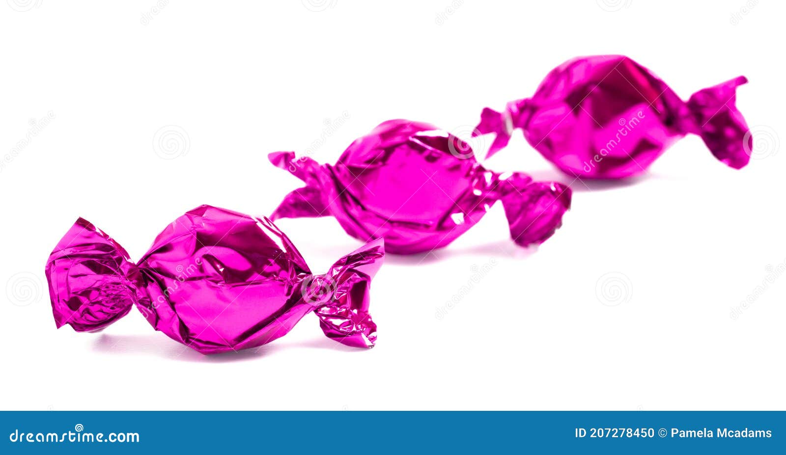 Three Pink Wrapped Candy on a White Background Stock Photo - Image of ...