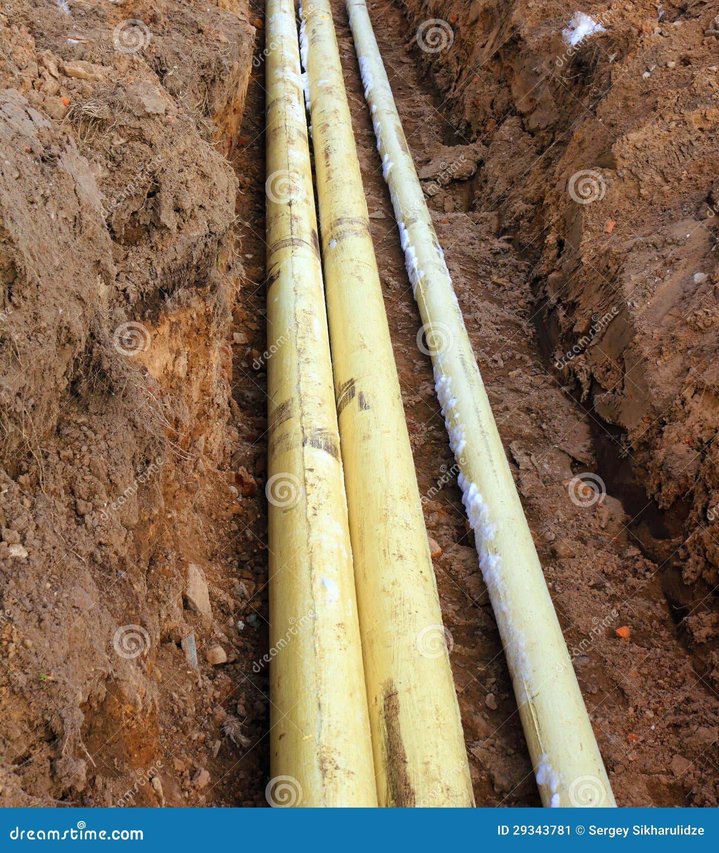 Three Pipes in the Trench in the Ground Stock Image - Image of ditch ...
