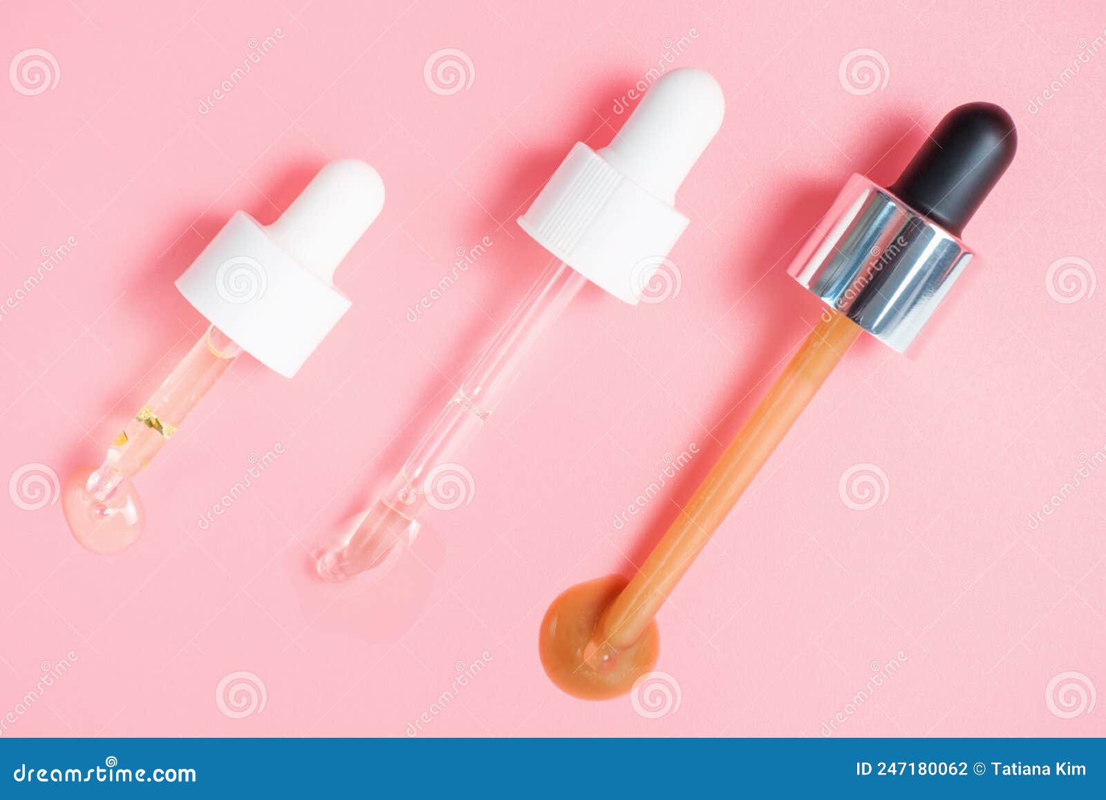 Three Pipettes with Serum and Collagen on a Pink Background Close-up ...