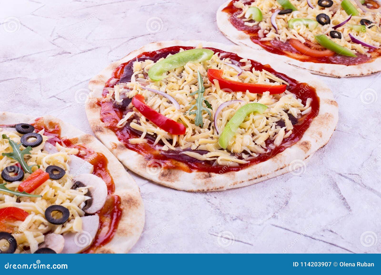Three pizzas on diagonal stock image. Image of food - 114203907