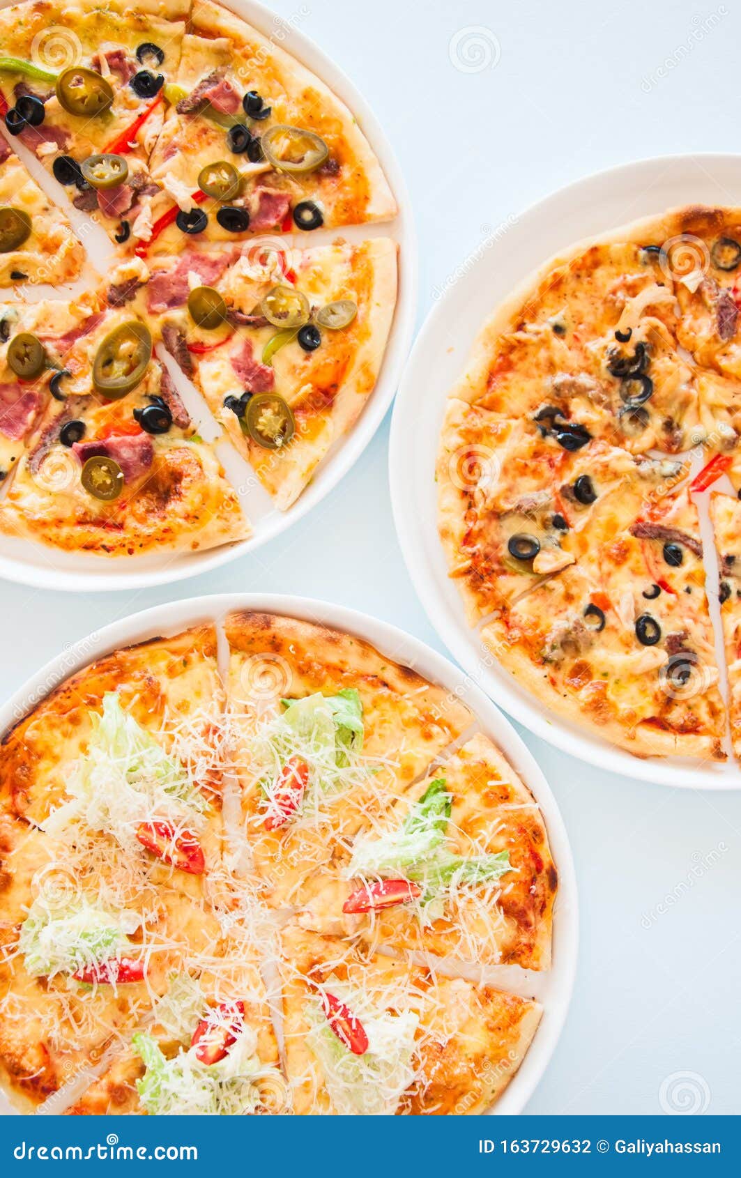 Three Pizzas with Different Fillings on a Table. Stock Photo - Image of ...
