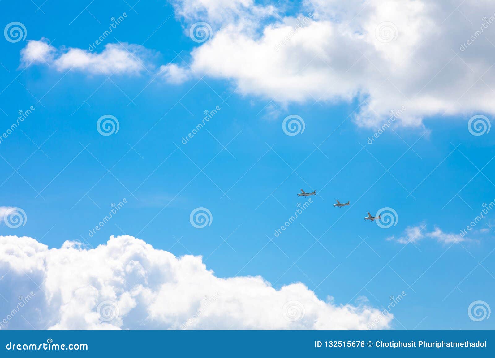 Three Planes Flying in the Blue Sky, Surrounded by Clouds and Sunlight ...