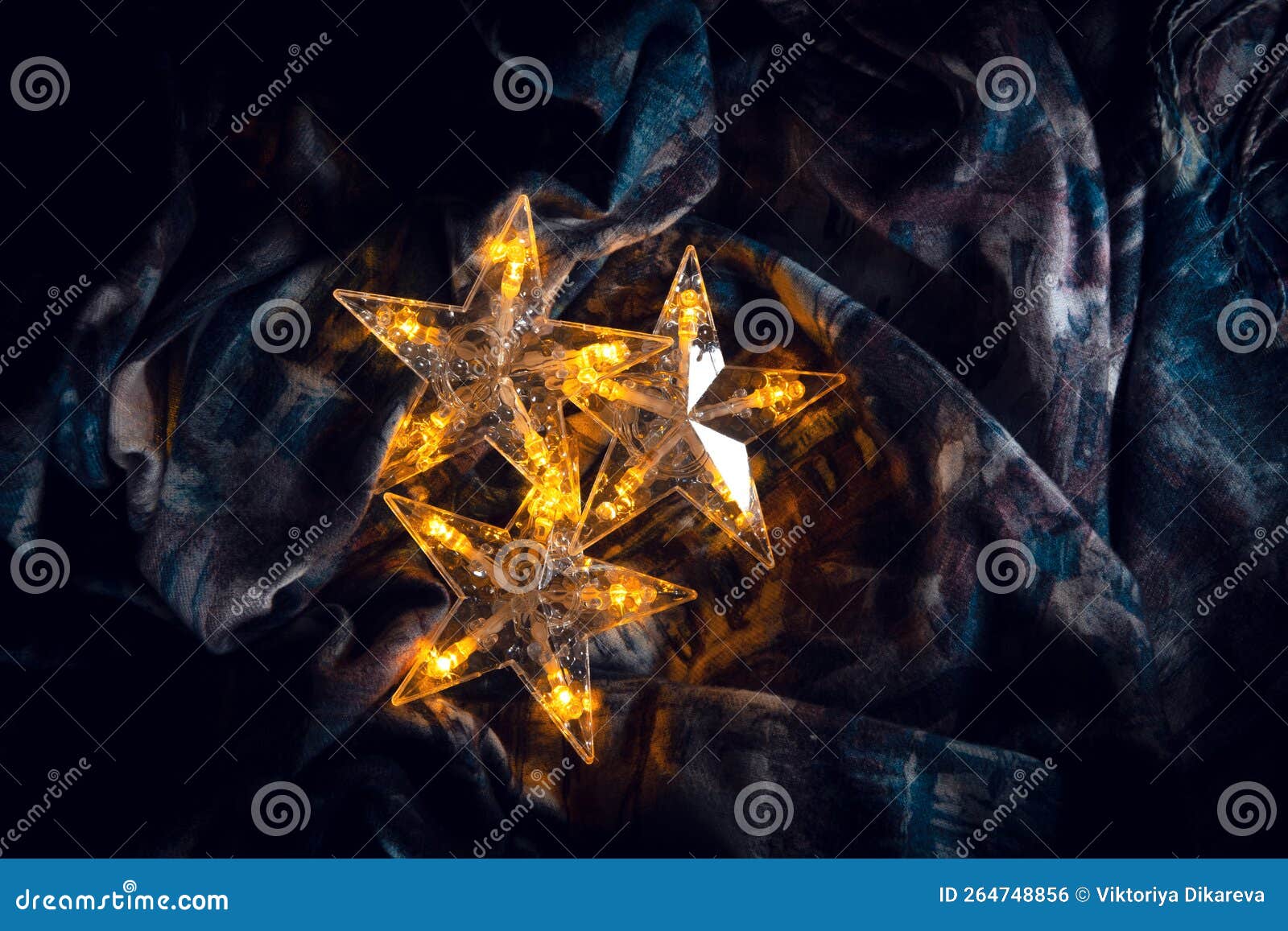 Three Plastic Five-pointed Luminous Stars, on a Substrate. Stock Photo ...