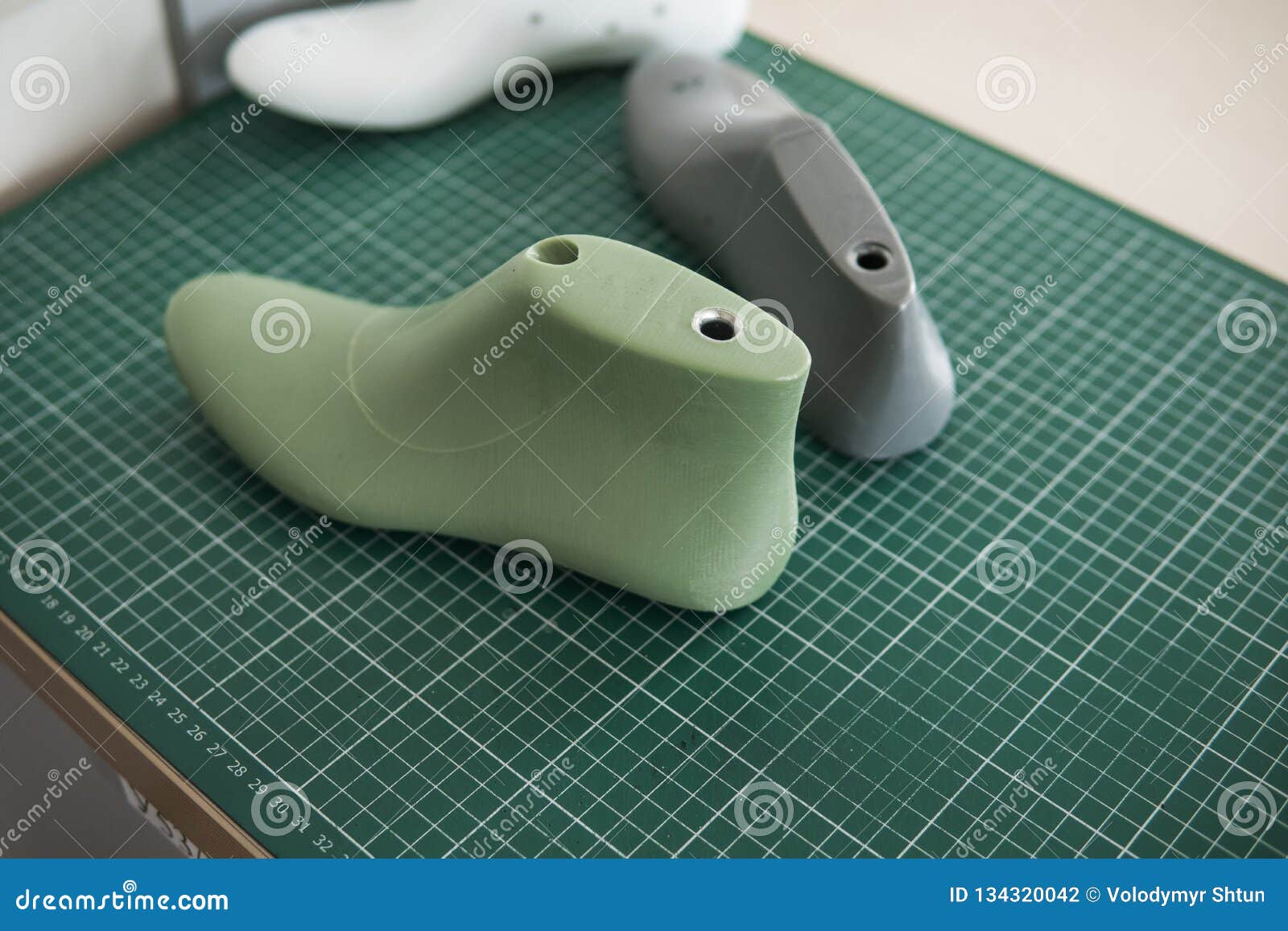 Three Plastic Last Shoe on Rubber Secondary Cut Cutting Mat, the ...