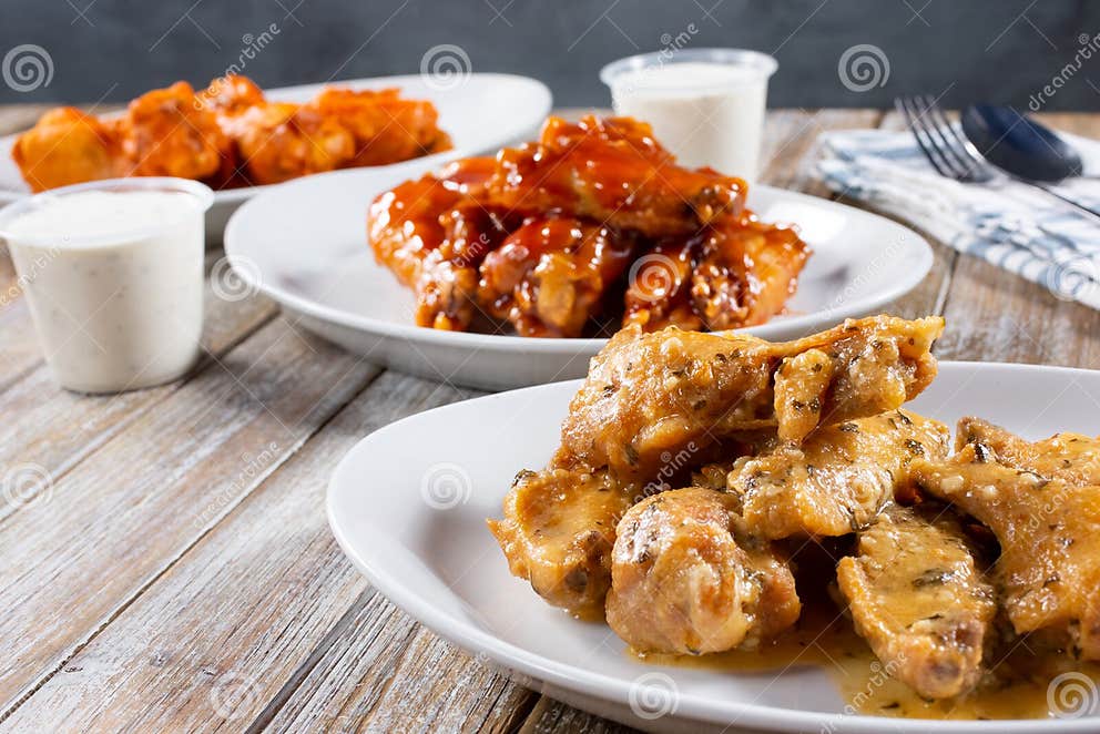 Three Plates of Assorted Chicken Wings Stock Image - Image of entree ...