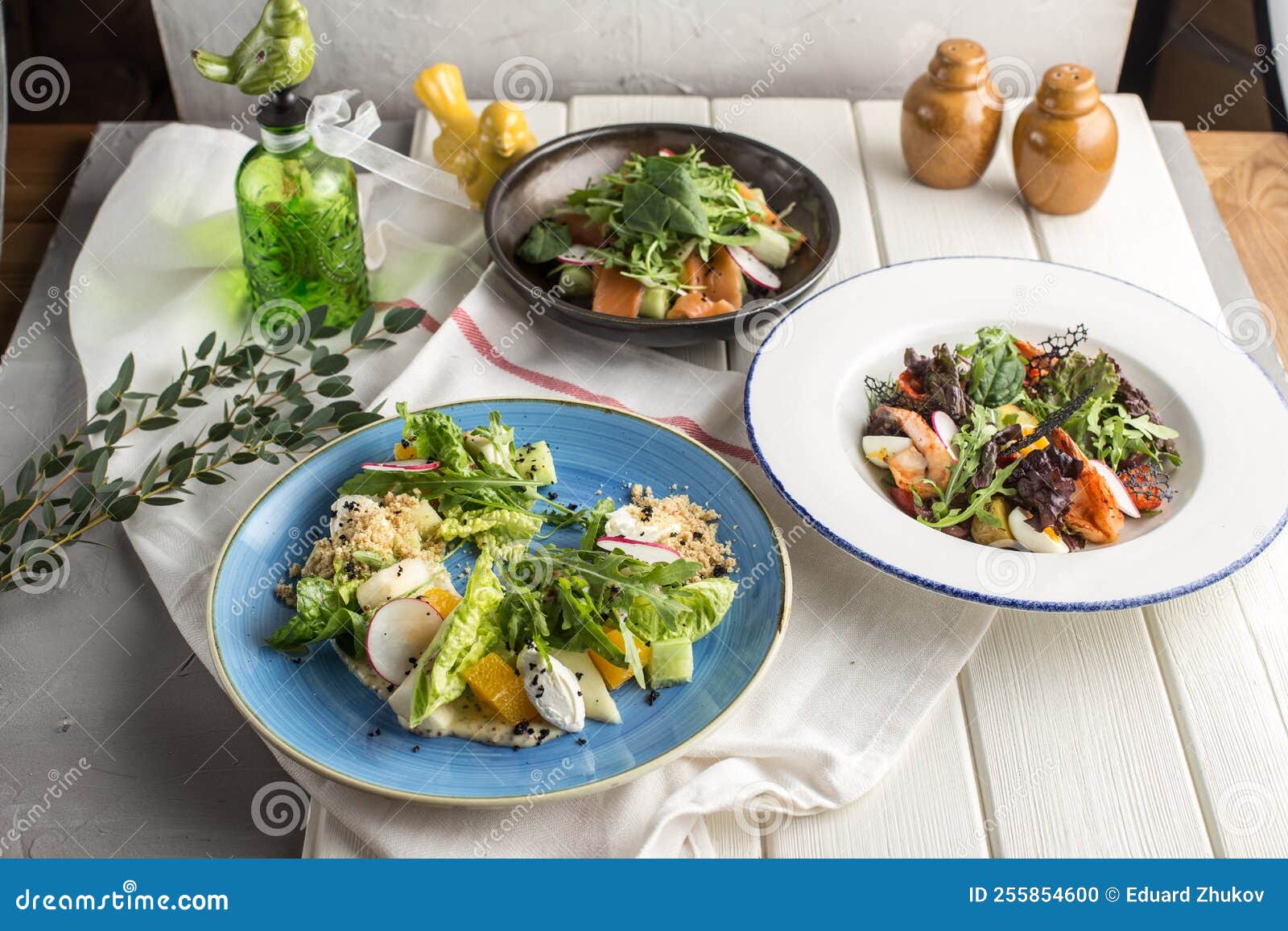 Three Plates Set of Green Healthy Salad on White Table Restaurant Menu ...