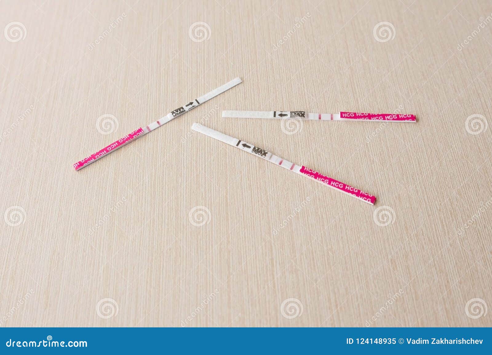 Three Positive Pregnancy Test Result with Two Strips on the Table Stock ...