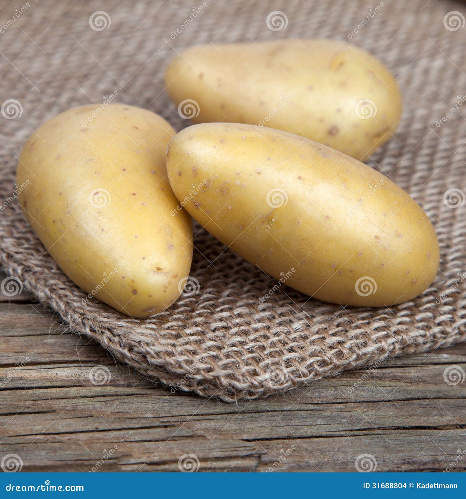 Three Potatoes Lying on a Bag Stock Photo - Image of isolated, potatoe ...