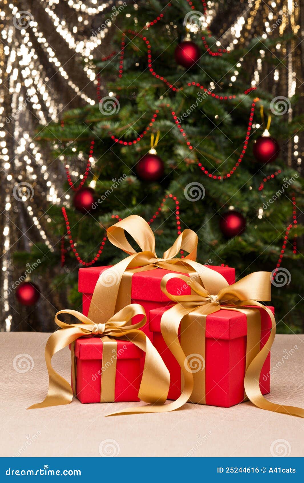 Three Presents with Gold Ribbon Stock Photo - Image of xmas, glitter ...