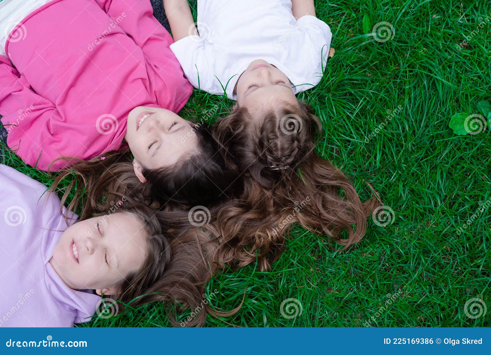 Three Pretty Girls Lying On Green Grass Sisterhood Friendship Bff