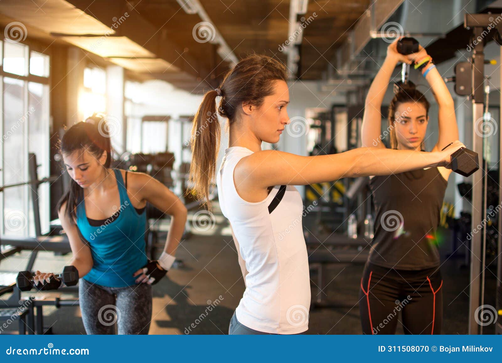 Three Pretty Girls Workout in the Gym Stock Photo - Image of athlete ...