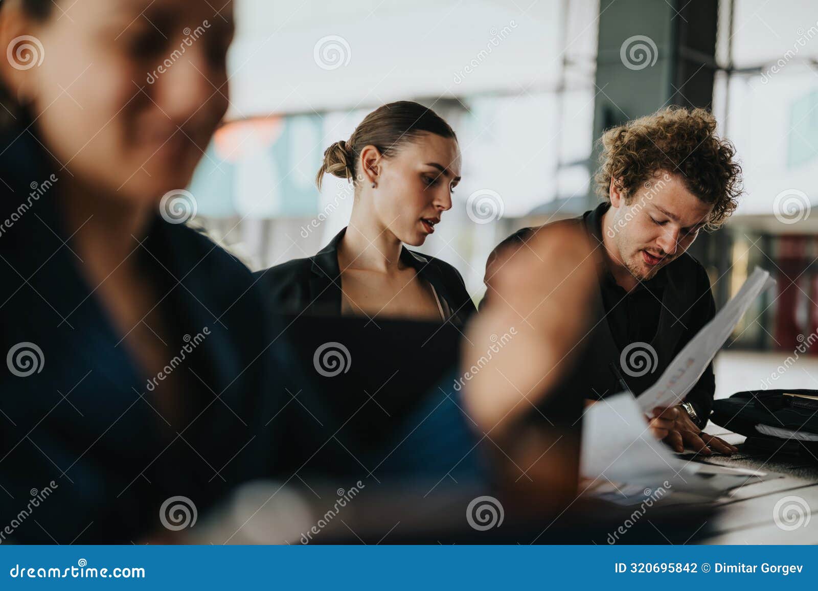 Team Collaborating at Work with Focus and Dedication Stock Photo ...