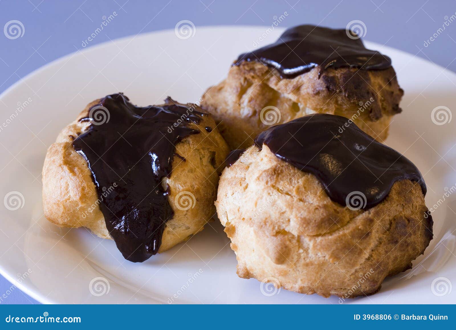 Three Profiteroles on a Plate Stock Photo - Image of dinner, appetizer ...