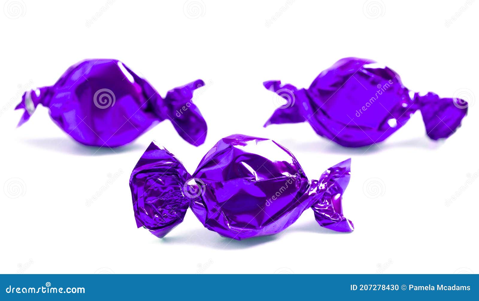 Three Purple Wrapped Candy on a White Background Stock Photo - Image of ...