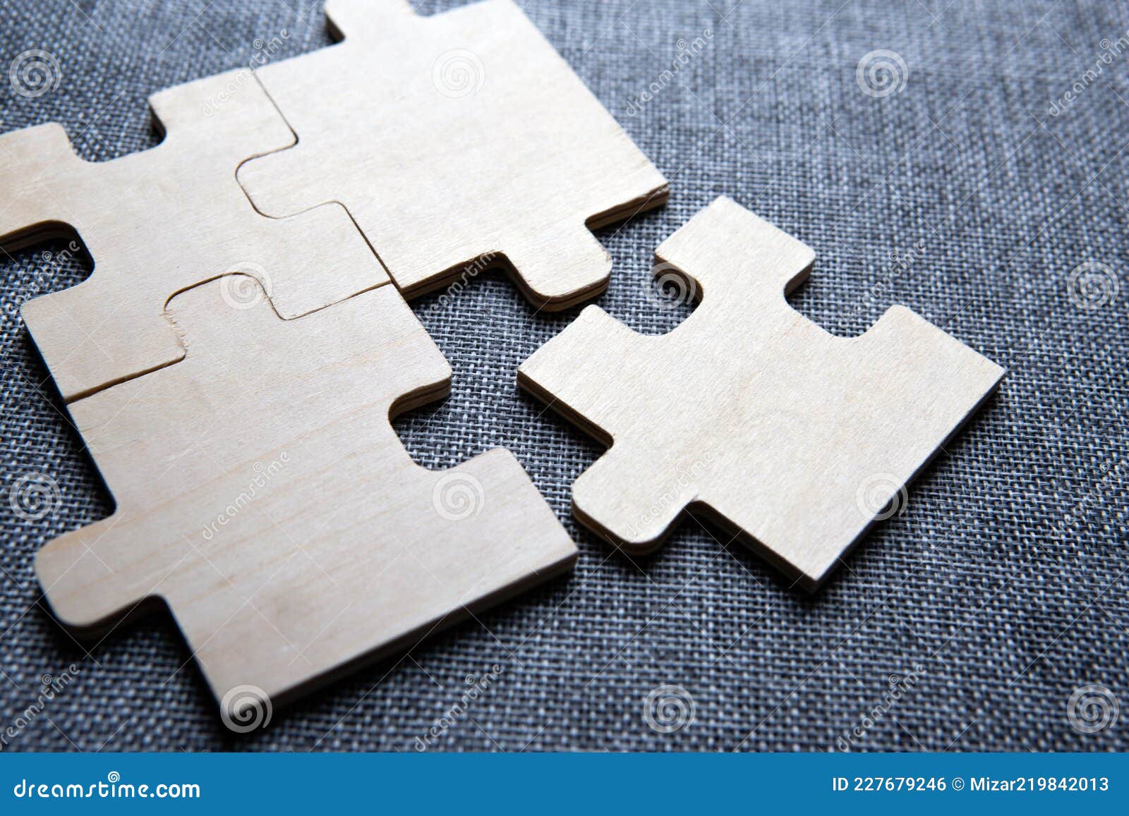 Three Puzzle Pieces in a Row on a Textile Background Stock Photo ...