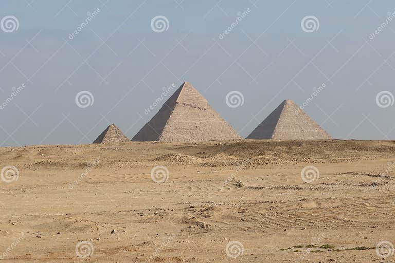 The Pyramids of Egypt Side by Side in the Middle of Desert Sand with ...