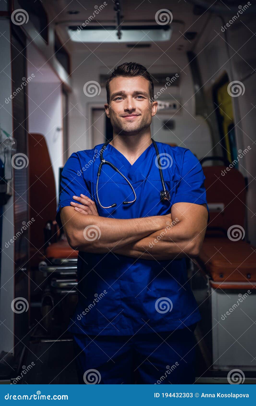 A Three Quarter Portrait of a Young Handsome Paramedic with His Hands ...