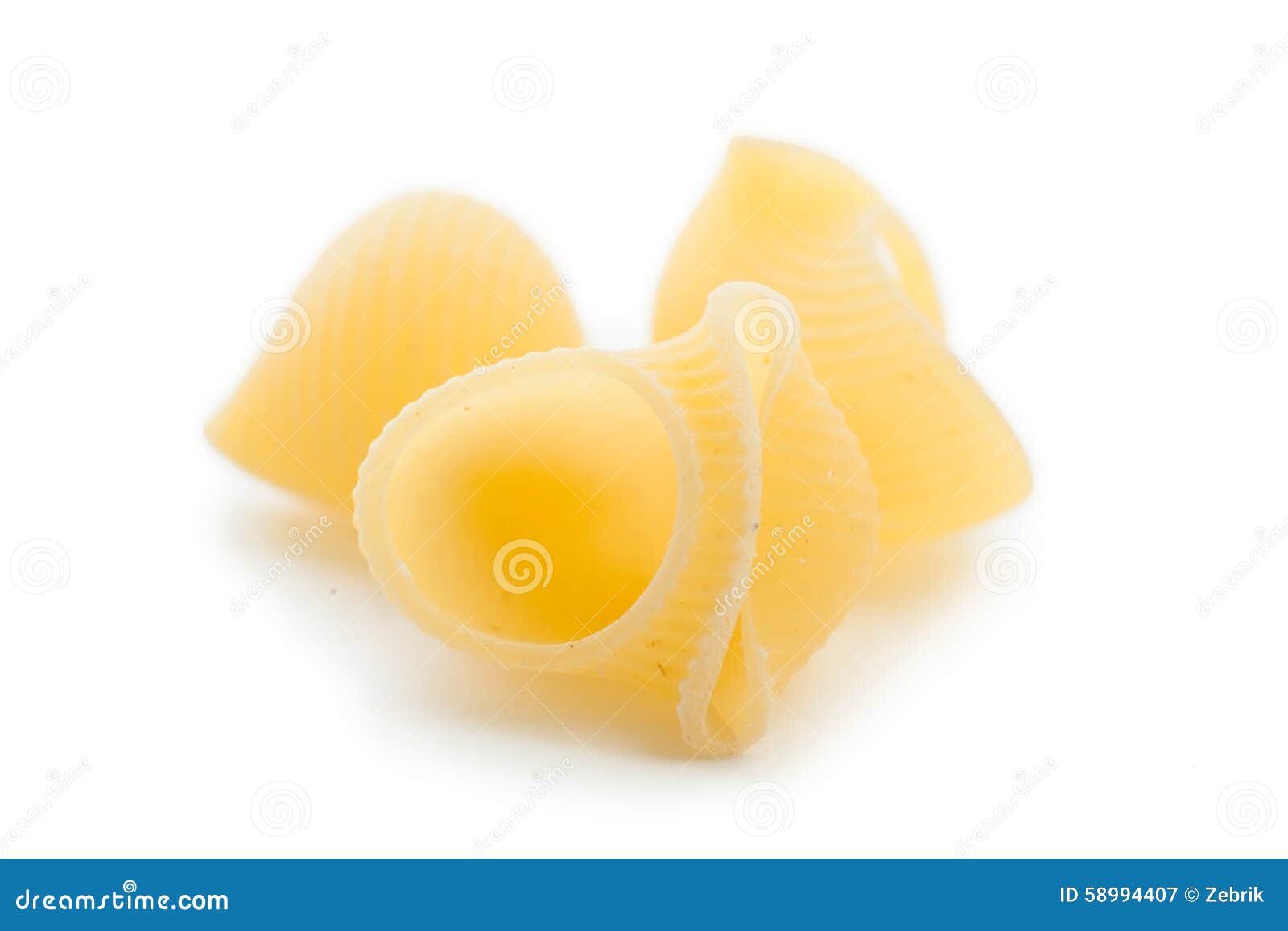 Three of Raw Macaroni Shells, Selective Focus. Isolated on White Stock ...