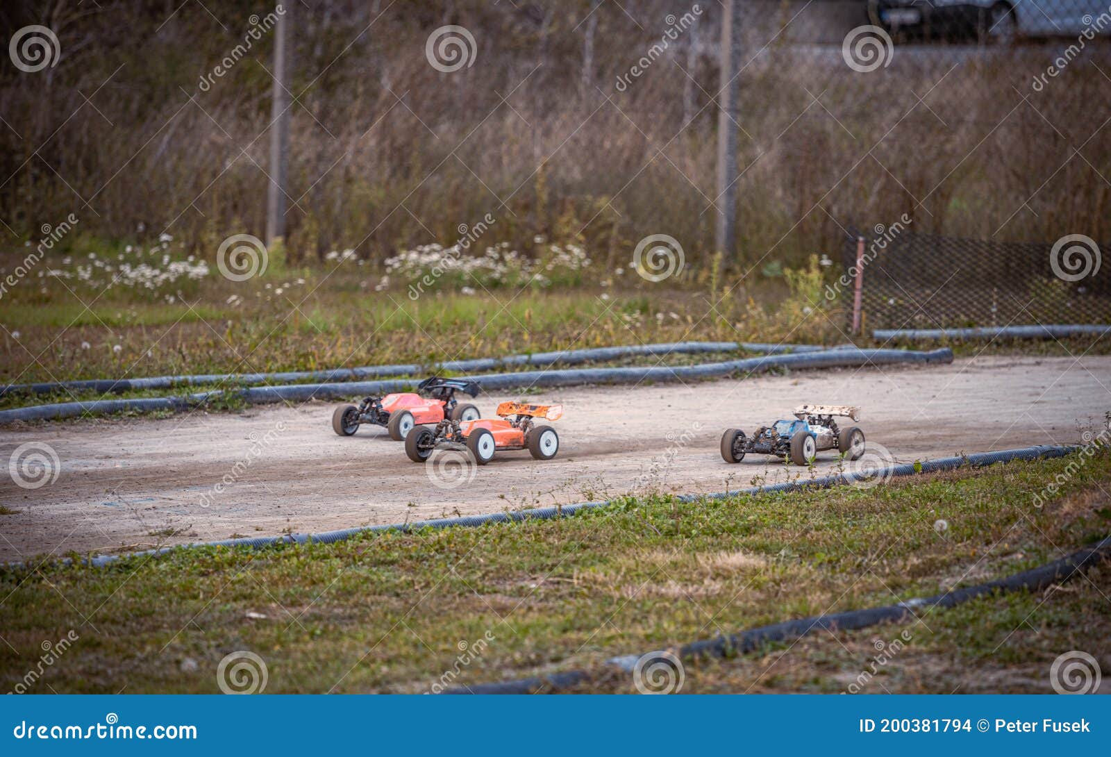 Racing Buggies Navigate Tight Corner During Dakar Rally, Kicking Up ...